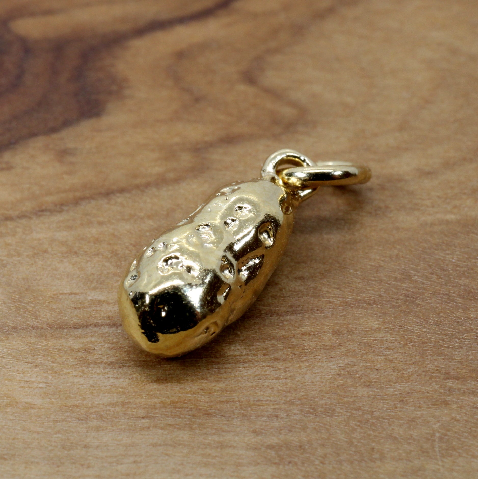 What material is the potato charm made from? (Gold Russet Potato Charm ...